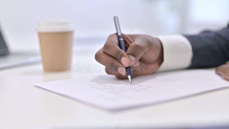 Hands of African Man Writing Letter at Work, Documents Stock Photo ...