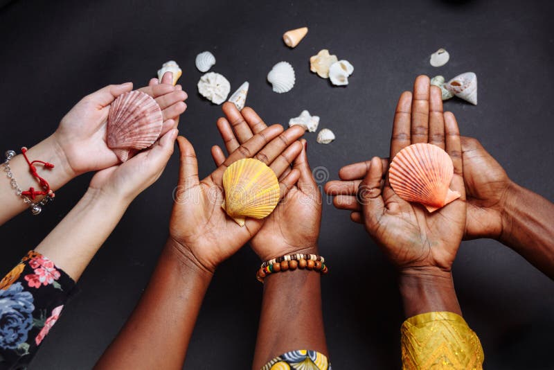 Hands of African People in Traditional Clothes Holding Seashells Stock ...