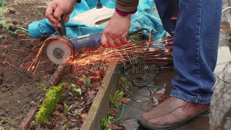 Hands with an Angle Grinder Cut Rusty Metalwork. Stock Footage - Video ...