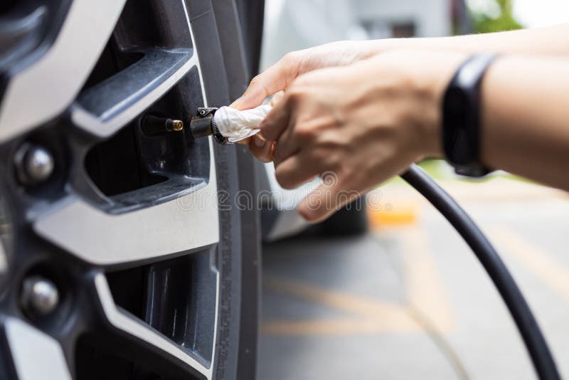 Hands of Asian People is Using Tissue Paper To Hold the Compressor ...