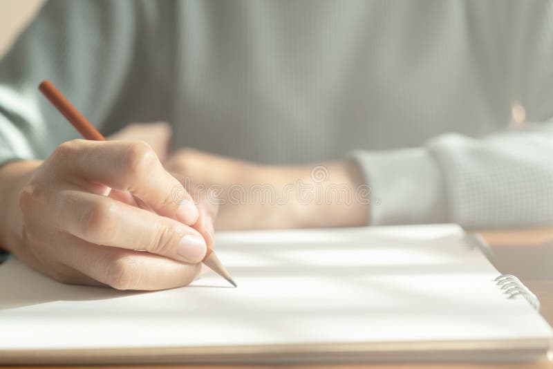 Hands of Asian Women are Taking Notes on the Wooden Table Stock Image ...