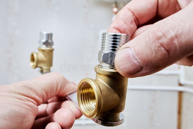 Hands Assembling Plumbing Parts with Threaded Adapter. Stock Photo ...