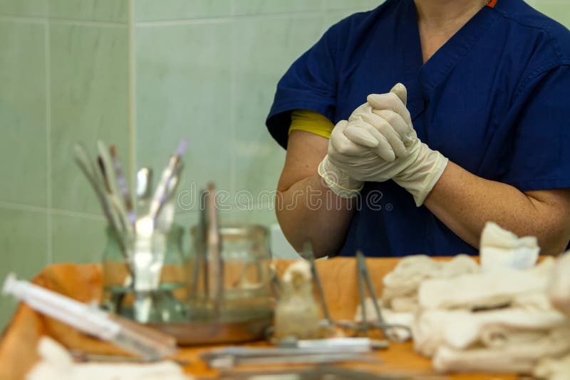 Hands of assistant surgeon stock photo. Image of room - 177191158