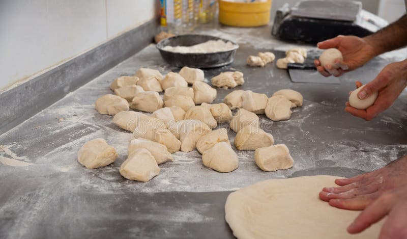 Baker shaping dough stock photo. Image of flatbread - 256078000