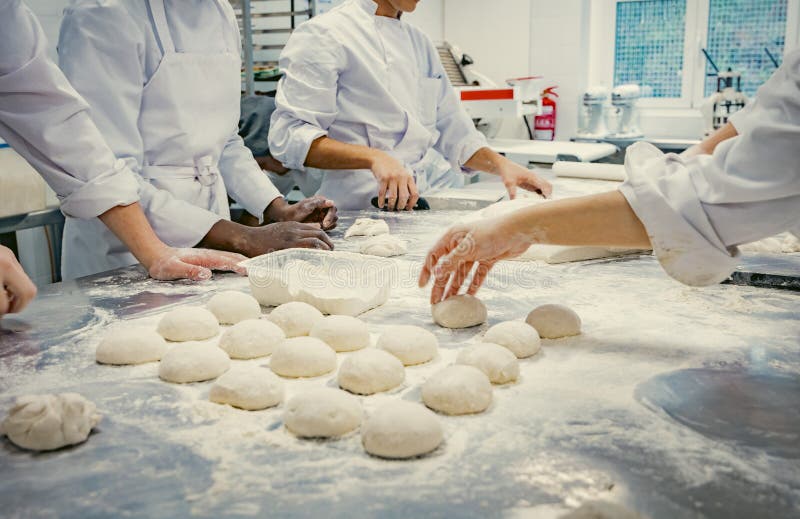Baking Students Preparing Fresh Dough in a Professional Kitchen Stock ...