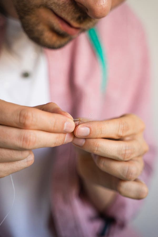 The Hands of a Beginner Underwear Designer Thread the Needle into the ...