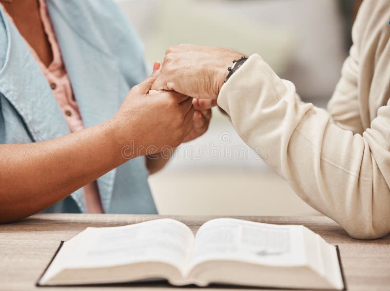 Hands Bible And Pray With A Senior Couple Reading A Book Together In