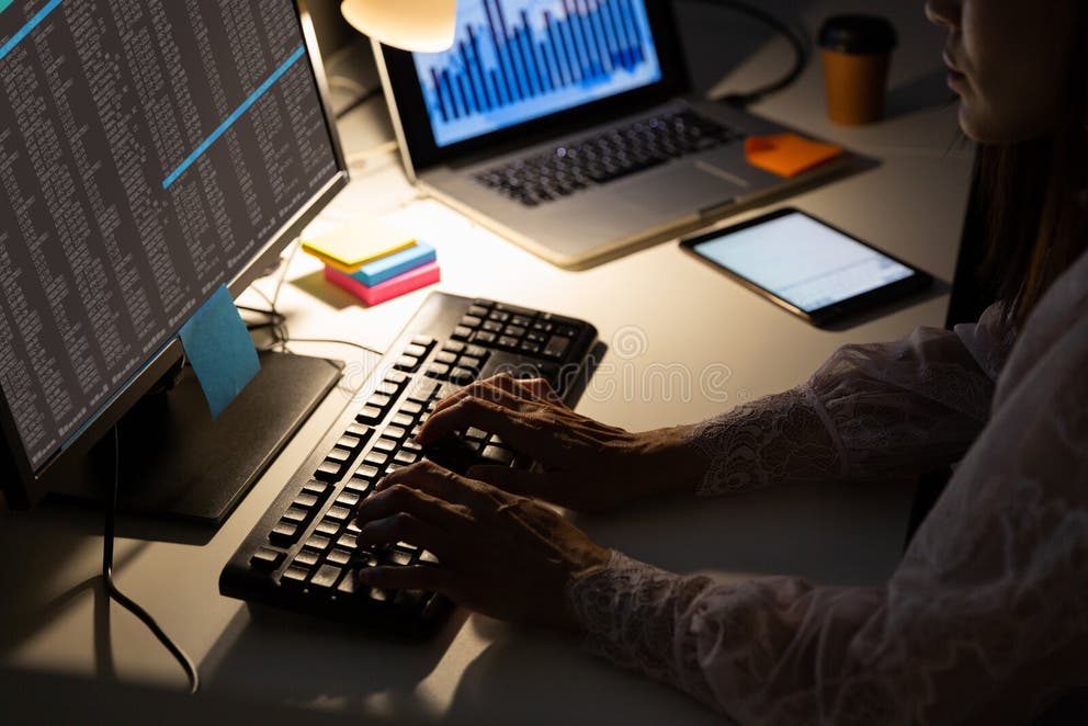 Hands of Biracial Female Programmer Sitting at Desk, Using Computer with Coding on Screen Stock ...
