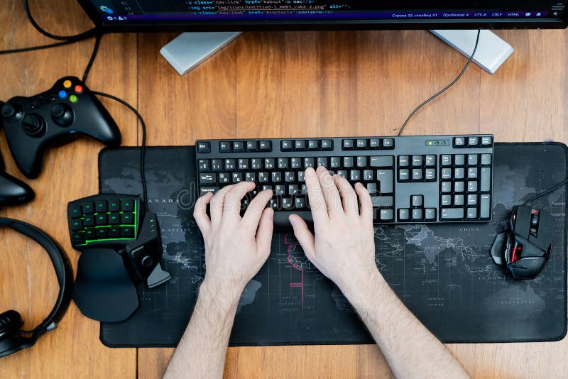 Hands on a black keyboard stock image. Image of desk - 180645089