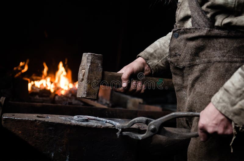 The Hands of a Blacksmith at Work in the Smithy Stock Photo - Image of ...