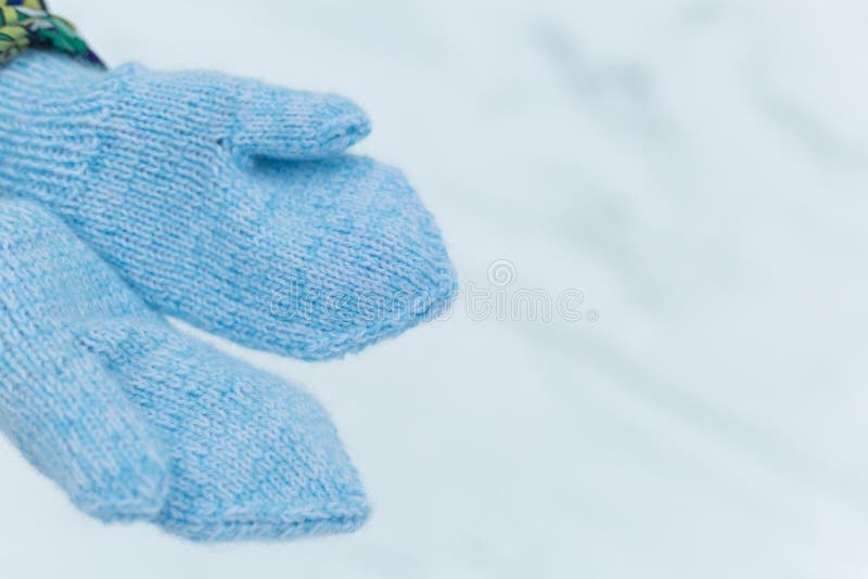 Hands in Blue Knitted Mittens in Snow Stock Image - Image of knitted ...