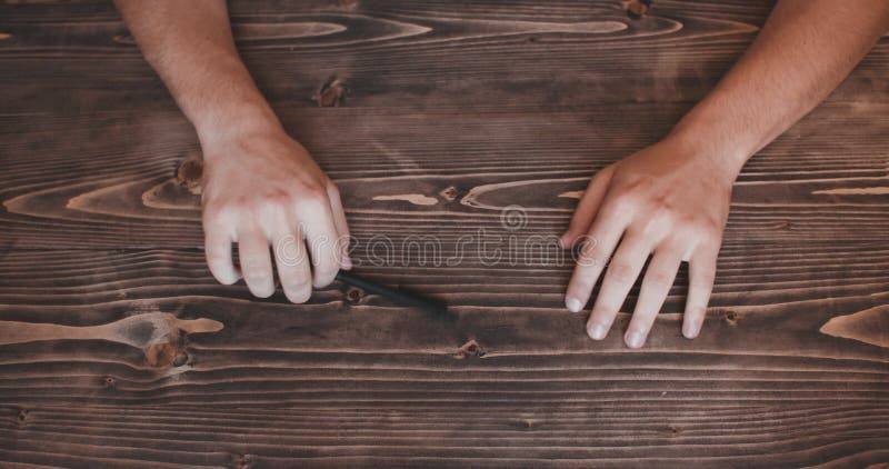 Hands of a Bored Man. Fingers Tapping on Table. Playing with Pen. Top ...