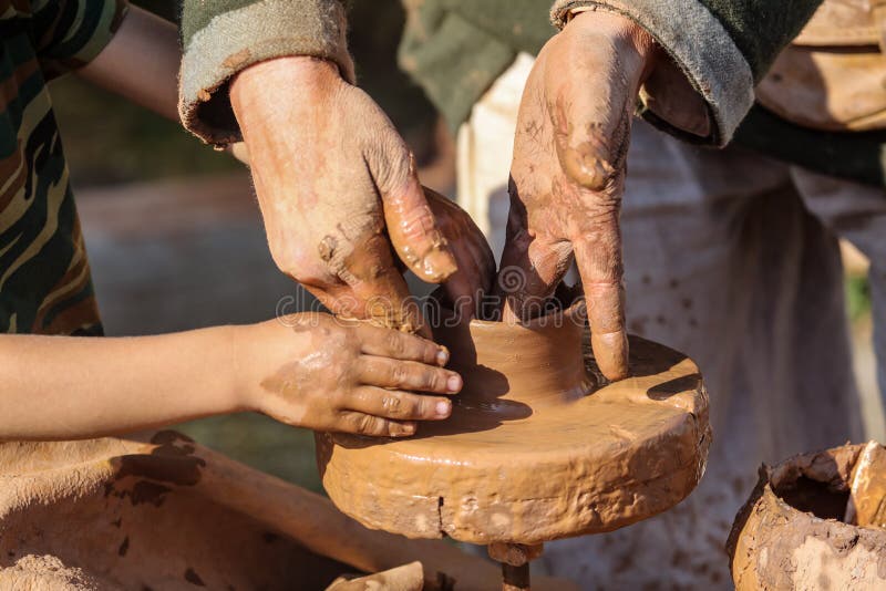 Hands of a Boy and a Man Sculpt Clay Dishes Stock Photo - Image of ...