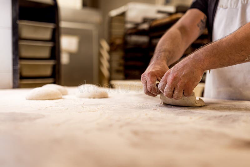 Hands of Bread Baker Kneading Fresh and Uncooked Bread Dough on Table ...