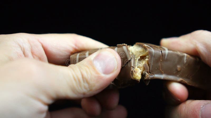 Hands Break a Bar of Chocolate. Snapping Chocolate in Half Stock Video ...