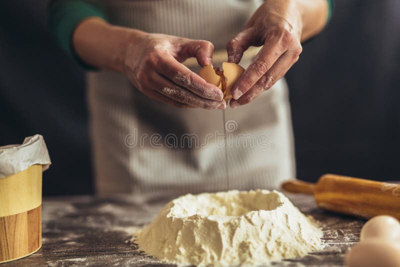 Woman Hands Breaking Egg into Raw Dough on Wooden Table Stock Photo ...