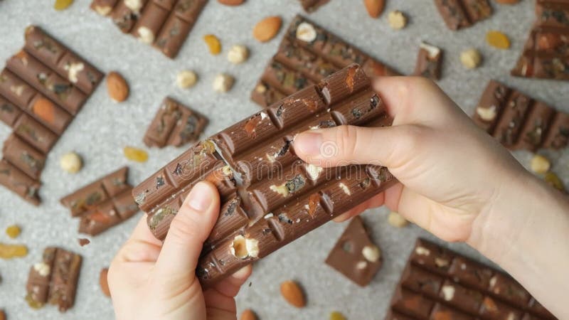 Hands Breaking Nut Chocolate Bar, Slow Motion. Stock Video - Video of ...