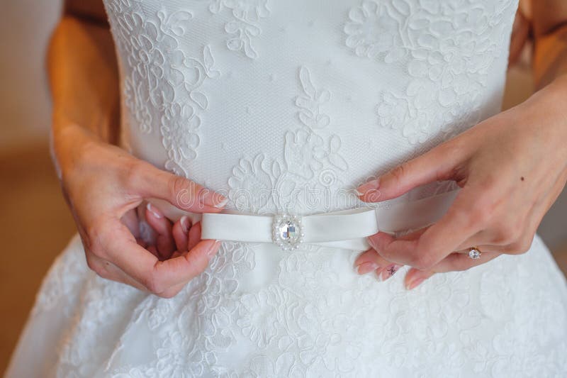 Hands of Bride on the Belt with Bow Stock Photo - Image of fashion ...