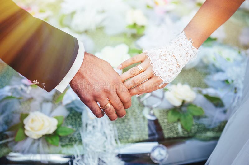 Hands of the Bride and Groom. Wedding Bouquet on Stock Photo - Image of ...
