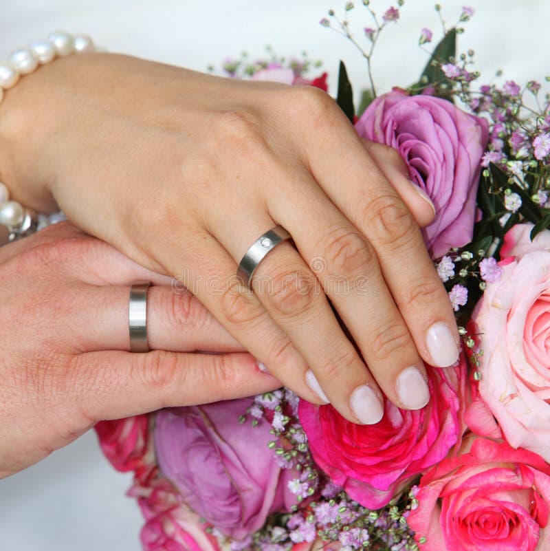 Hands of a Bride and Groom with Wedding Rings Stock Image - Image of ...