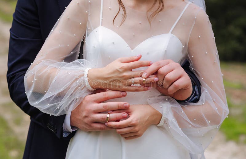 Hands of Brides with Gold Wedding Rings Close Up Stock Photo - Image of ...