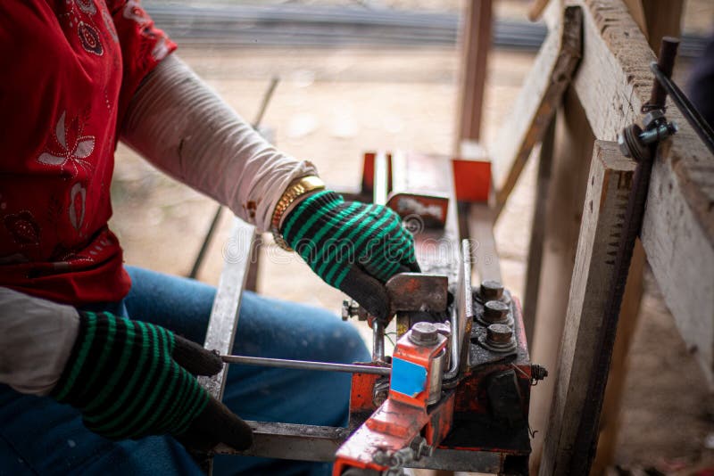 The Hands of the Builder are Bending the Iron with an Iron Bending ...