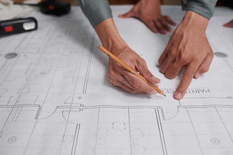 Builders Examining Building Blueprint Stock Photo - Image of occupation ...