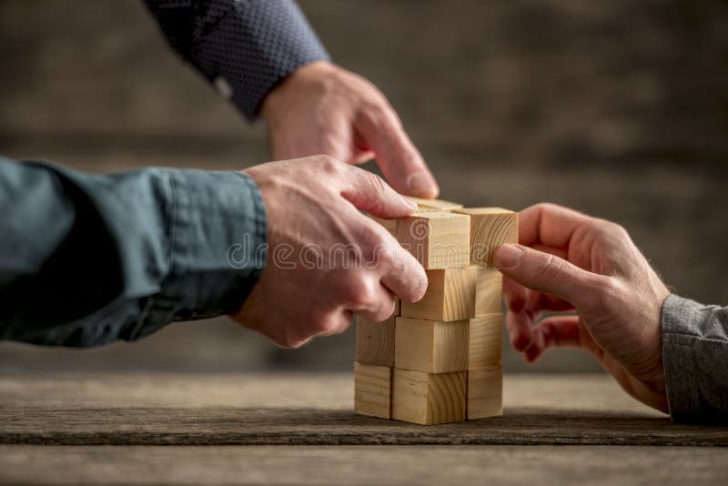 Hands Building a Tower of Wood Blocks Stock Photo - Image of ...