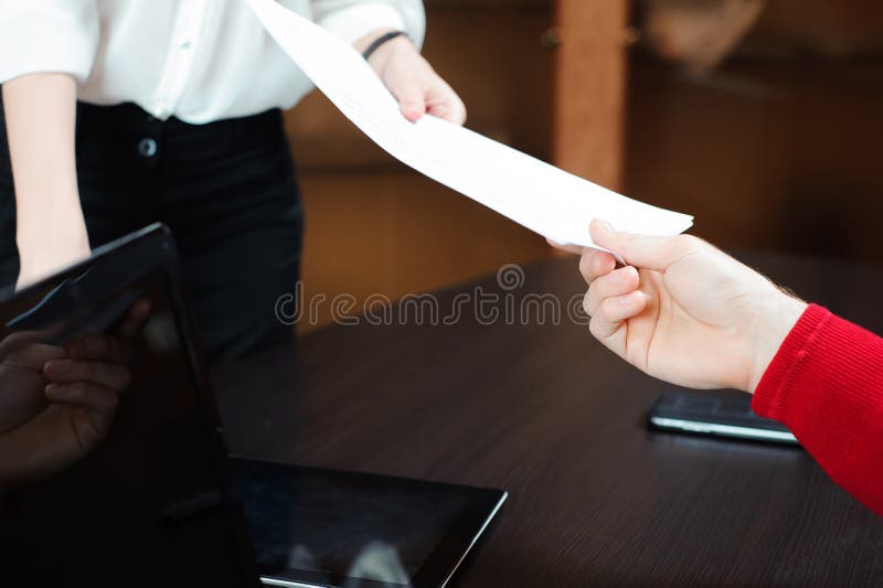 Woman Passing Paper Stock Photos - Download 353 Royalty Free Photos