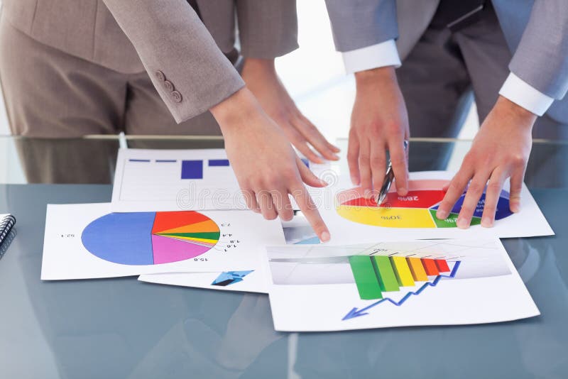 Hands of Business People Studying Statistics Stock Image - Image of ...