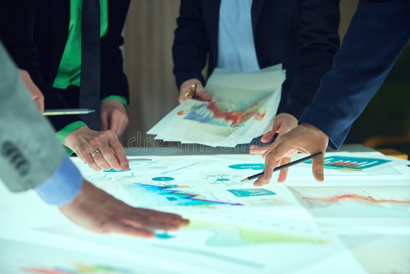 Hands of Business People on Table. Team Looking on Digital Documents ...