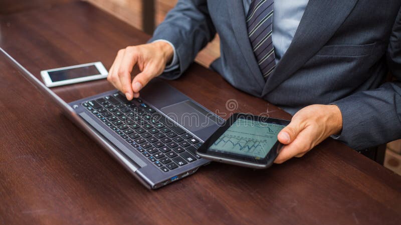 Hands of Businessman with Laptop,mobile Phone and Tablet. Stock Image ...