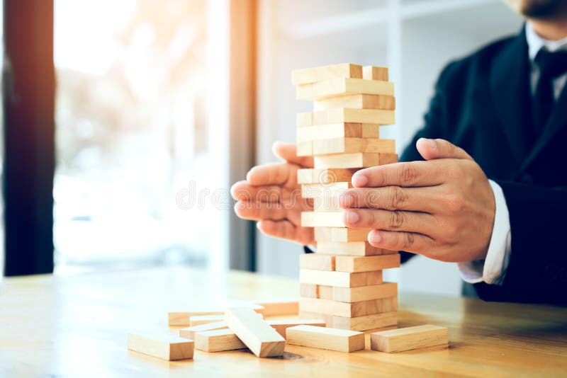 Hands of Businessman Protect Block Wooden on Table with Risk Con Stock ...