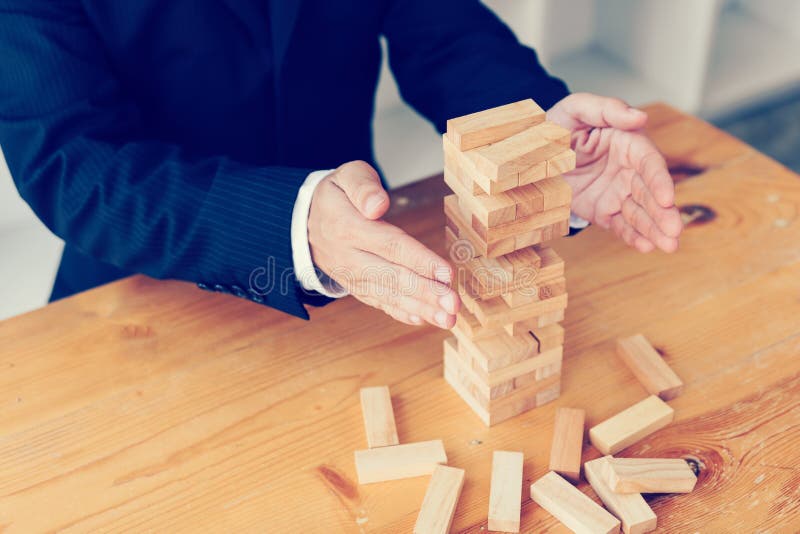 Hands of Businessman Protect Block Wooden on Table with Risk Concept ...
