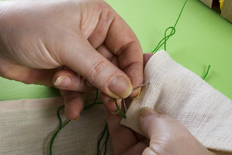 Hands are busy sewing stock image. Image of materials - 113529915