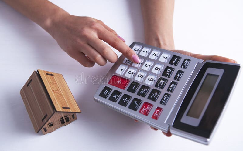 Hands calculator house stock image. Image of payment - 140264883