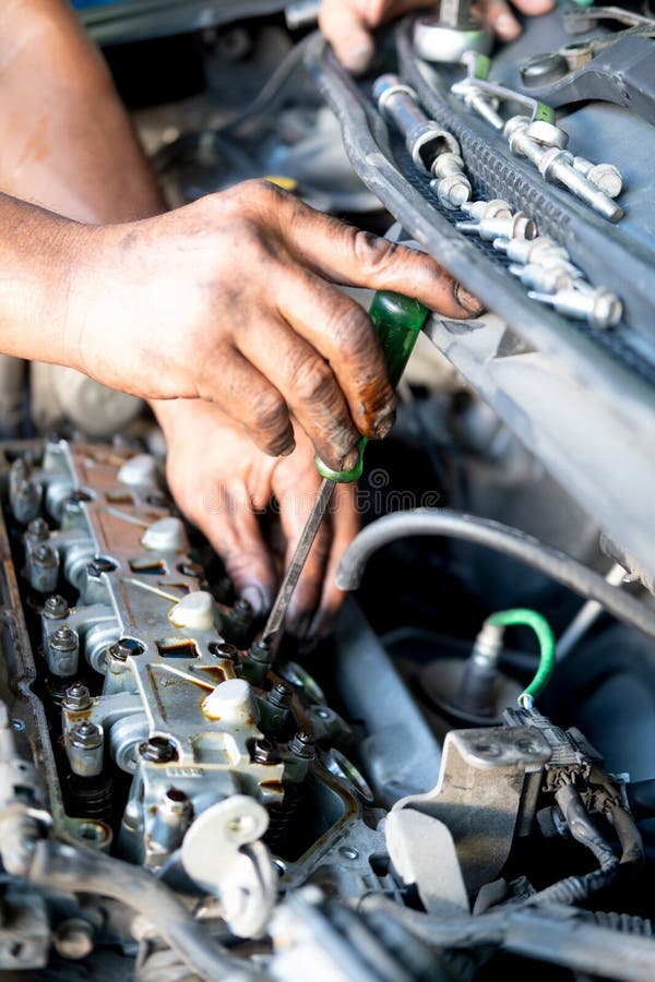 Hands of Car Mechanic with Screwdriver Stock Image - Image of pouring ...