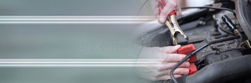 Hands of Car Mechanic Using Car Battery Jumper Cable Panoramic Banner ...