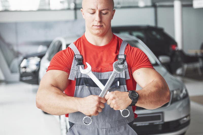 Hands of Car Mechanic with Wrench in Garage Stock Photo - Image of ...