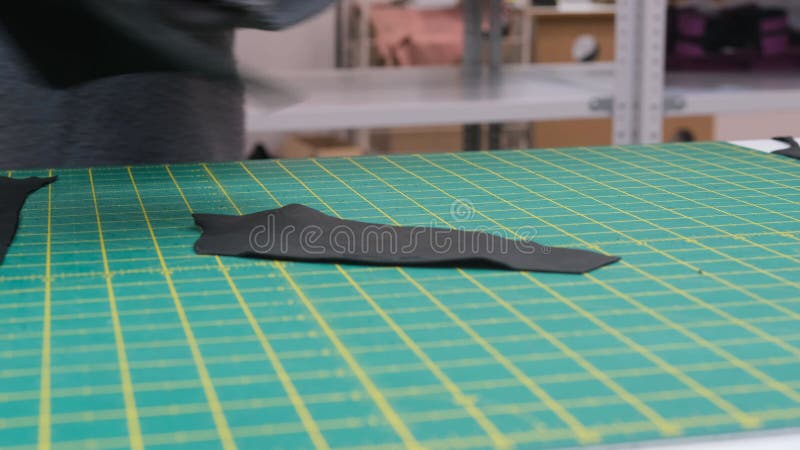 Close-Up of Person Cutting Fabric with Scissors in Craft Room during ...