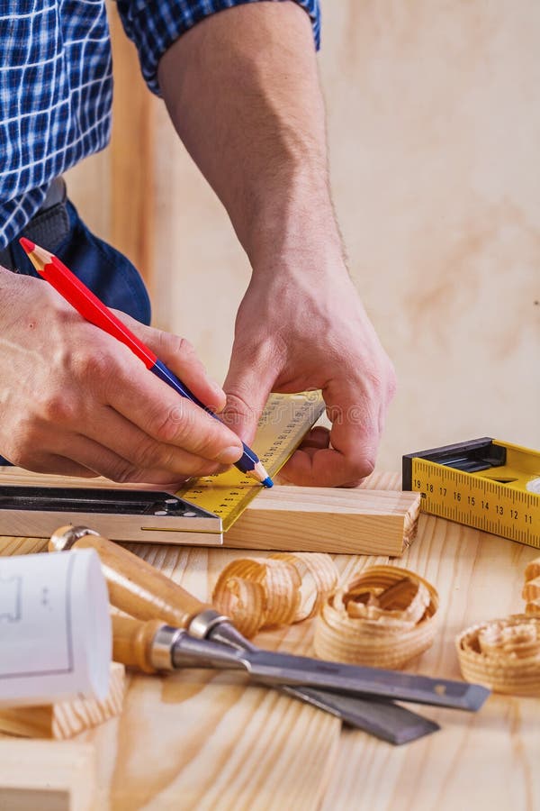 Hands of Carpenter Drawing with Pencil on Wooden Stock Photo - Image of ...