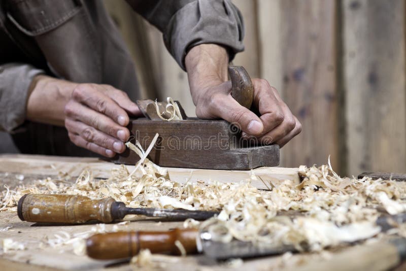 Hands of Carpenter Plane on Workbench in Carpentry Stock Image - Image ...
