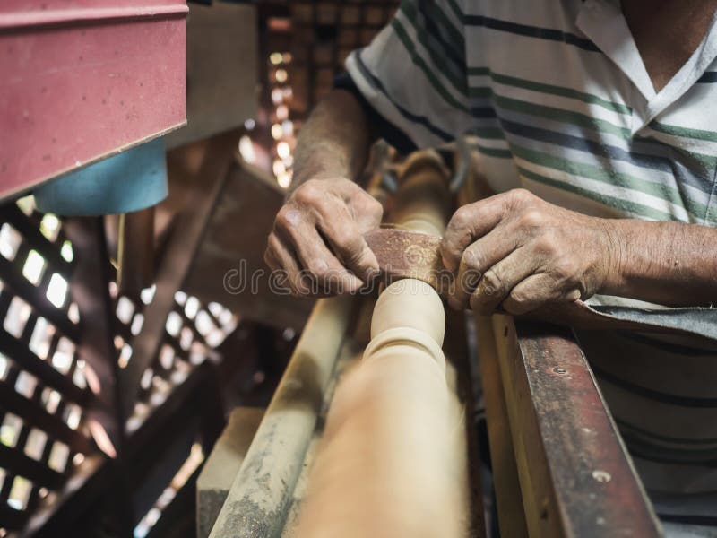 Hands of Carpenter Turning Wood on Lathe Machine in Carpentry Workshop ...