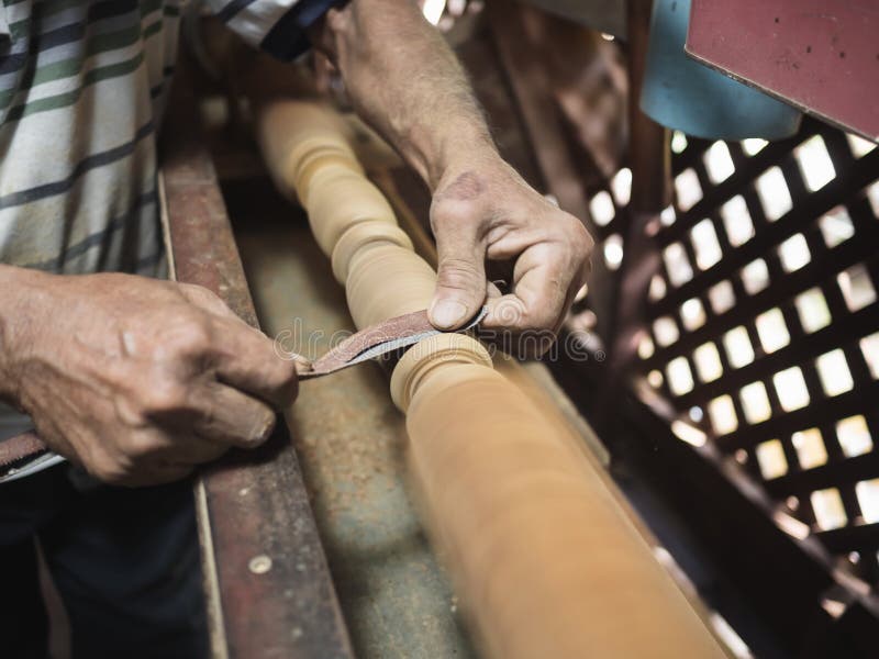 Hands of Carpenter Turning Wood on Lathe Machine in Carpentry Workshop ...