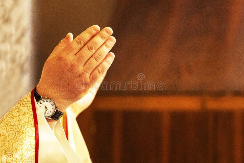 Hands of a Catholic Priest when Praying at a Holy Mass Stock Photo ...