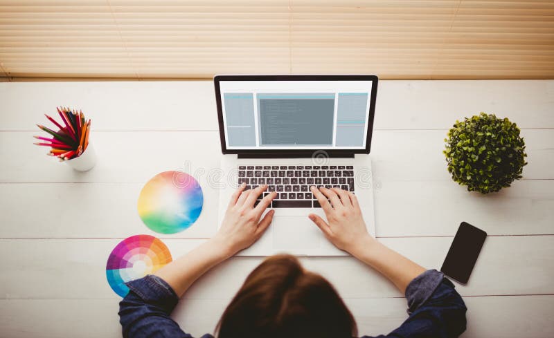 Hands of Caucasian Female Programmer with Colour Charts Using Laptop ...