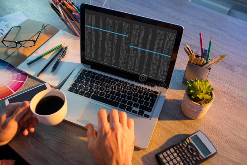 Hands of Caucasian Male Programmer Sitting at Desk and Using Laptop with Coding on Screen Stock ...