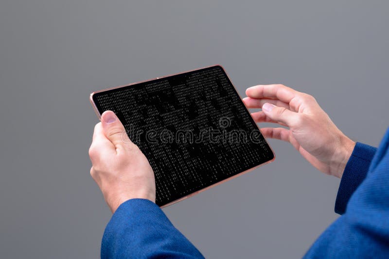 Hands of Caucasian Male Programmer Using Tablet with Coding on Screen ...