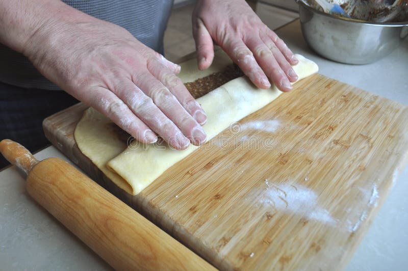 Hands of a Caucasian Man Rolling a Pastry on a Wooden Board Stock Image ...