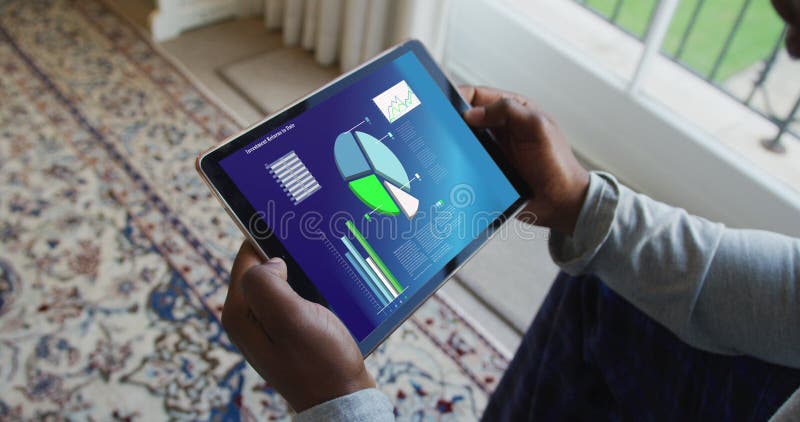 Hands of Caucasian Man Sitting on Sofa, Using Tablet with Statistics on ... Hands of Caucasian Man Sitting on Sofa, Using Tablet with Statistics on ...